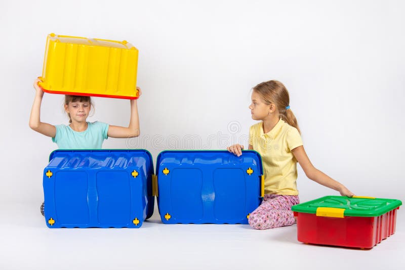Two Girls Play with Large Plastic Boxes Stock Photo - Image of gift ...