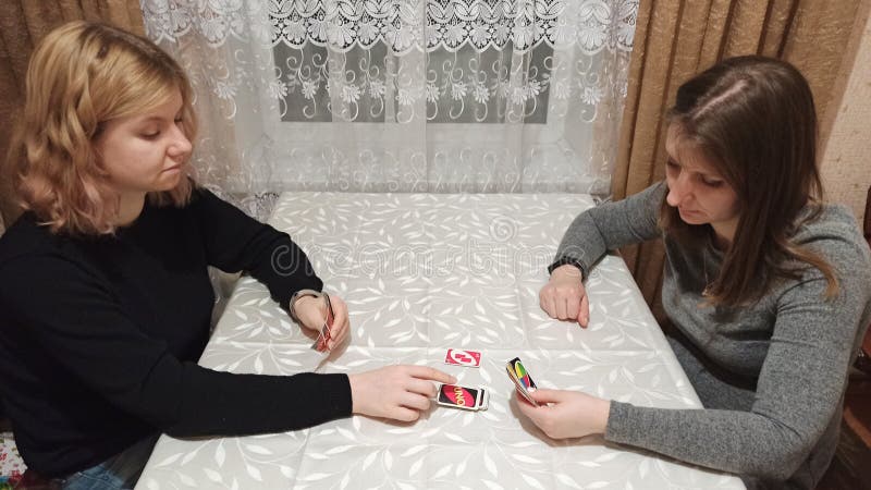 Girls Play Uno Cards at Table Editorial Photo - Image of excitement ...