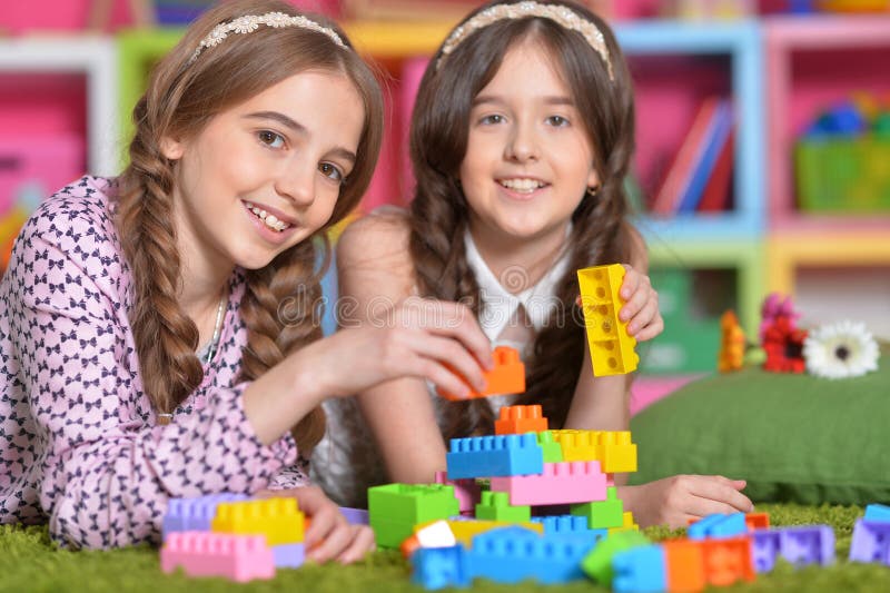Two Girls Playing with Colorful Plastic Blocks Stock Photo - Image of ...