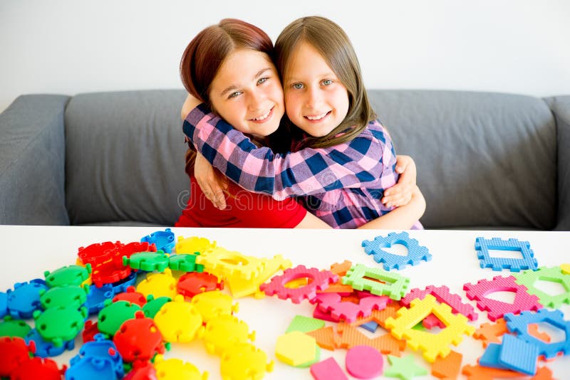Two girls playing lego stock image. Image of happy, play - 95144577