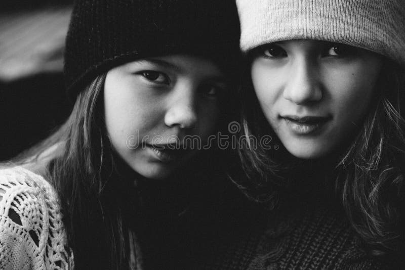 Two Girls Playing in the Street Together Stock Photo - Image of laugh ...