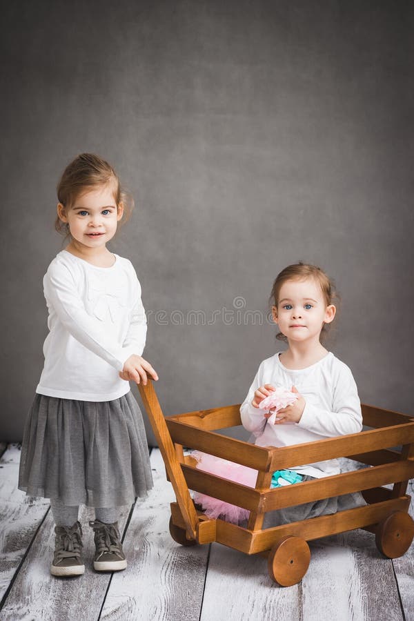 Two Girls are Playing with Trolley Stock Photo - Image of family ...