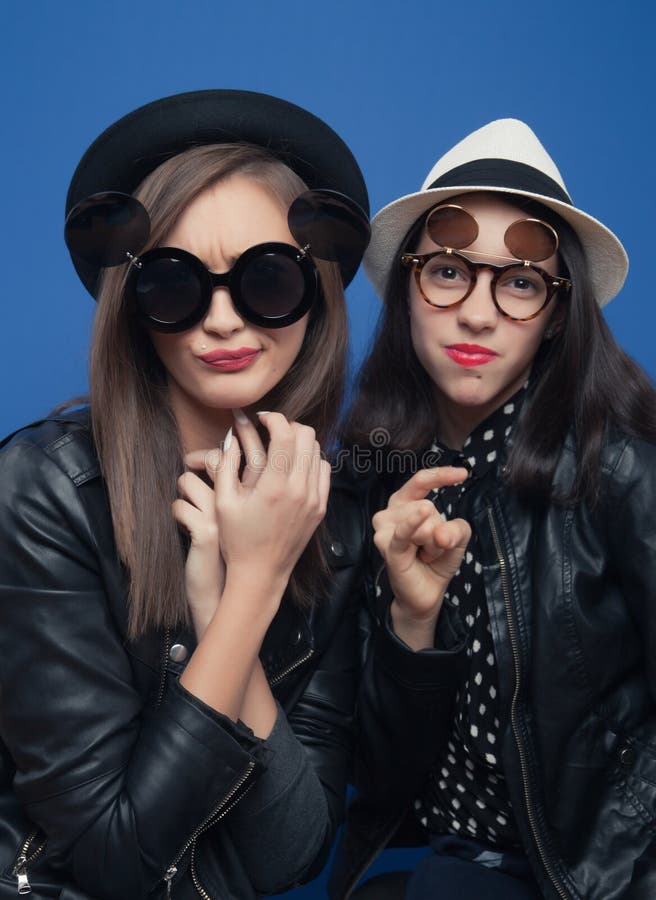 Two Girls Posing in Photo Boot Stock Photo - Image of sunglasses ...
