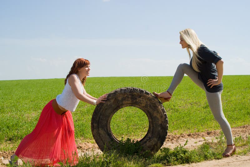 Two girls rolls wheel stock image. Image of beautiful - 26415935