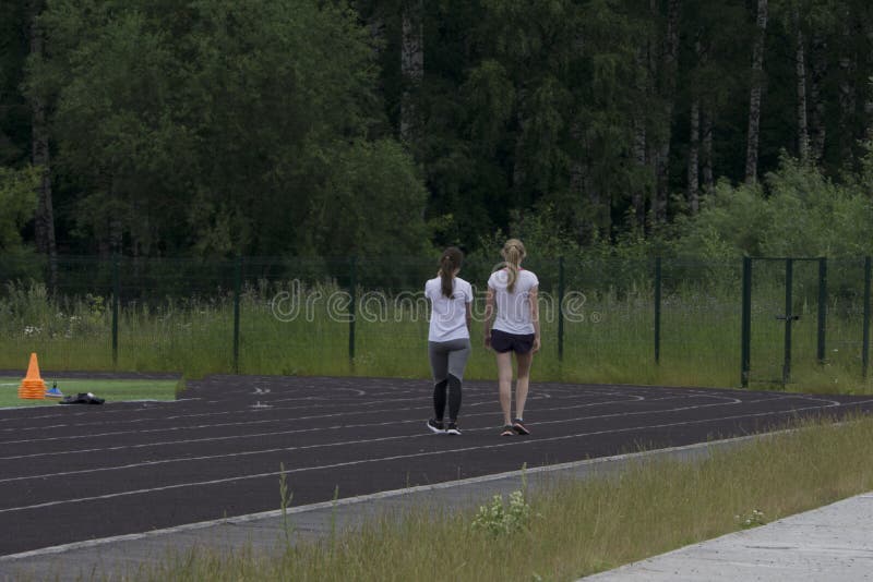Two Girls Run Along the Paths Editorial Stock Photo - Image of ...