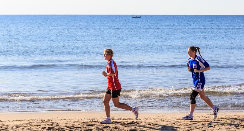 Two Girls Running on the Beach Editorial Photography - Image of ...