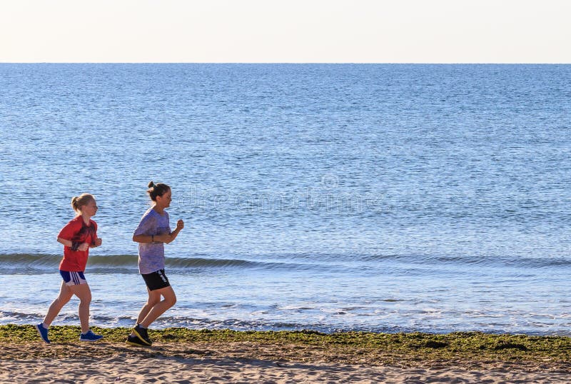 Two Girls Running on the Beach Editorial Stock Photo - Image of ...