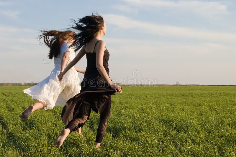 Two Girls Running on the Field 3 Stock Photo - Image of horizon, human ...