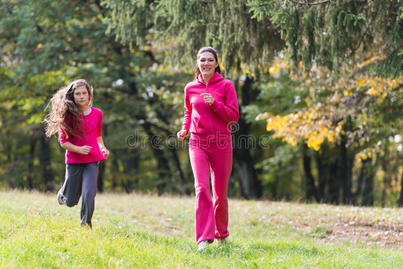 Two girls running stock image. Image of meadow, jogging - 34489927