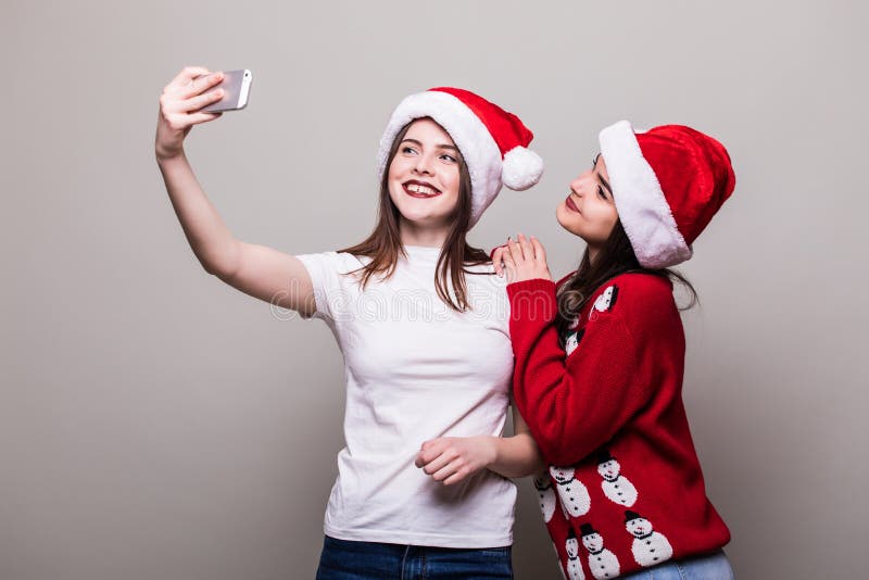 Two girls in Santa hat stock image. Image of childhood - 82191645