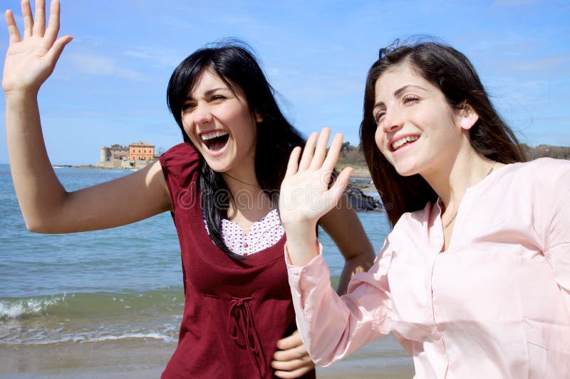Two Girls Saying Hello To Friends Stock Image - Image of attractive ... Two Girls Saying Hello To Friends Stock Image - Image of attractive ...