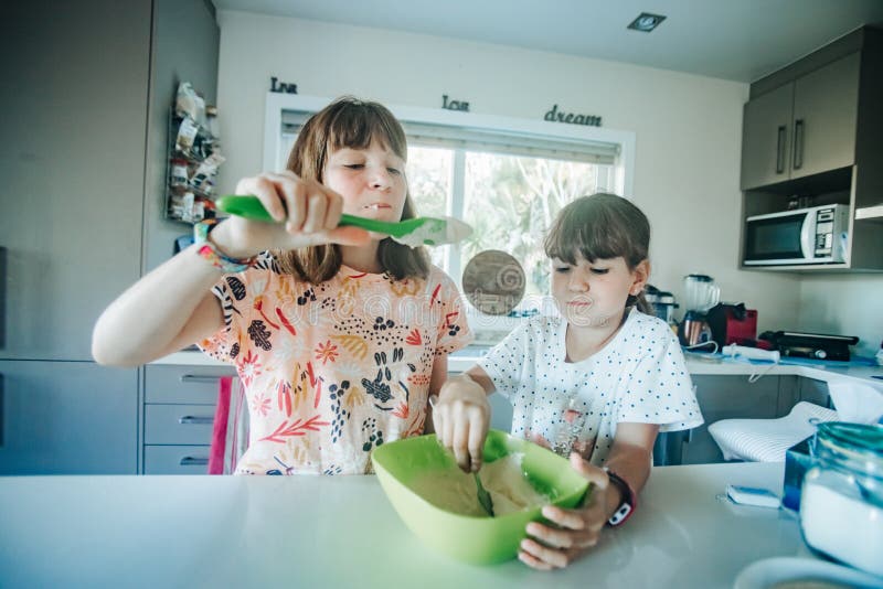 Two Girls Sisters Baking at Home Stock Image - Image of meal, dessert ...