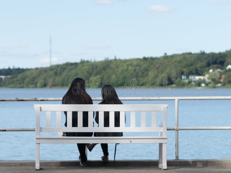 Two Girls Sitting on a Beach in Viborg, Denmark Editorial Stock Image ...