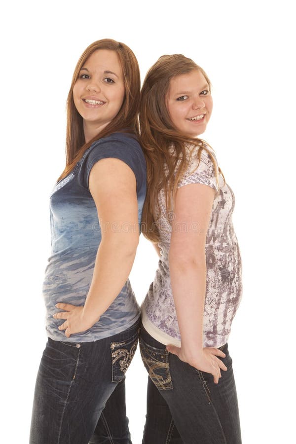 Two Girls Stand Back To Back Stock Photo - Image of family, laughing ...