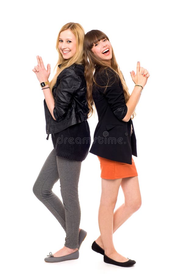 Two Girls Standing Back To Back Stock Image - Image of happiness ...