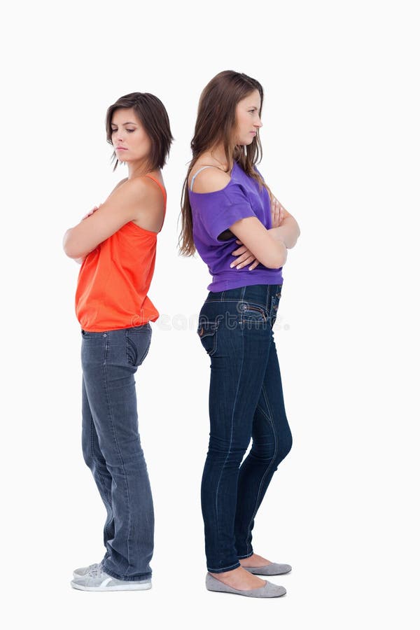 Two Girls Standing Back To Back Stock Photo - Image of attractive ...