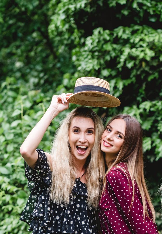 Two girls in a summer park stock image. Image of people - 127543803