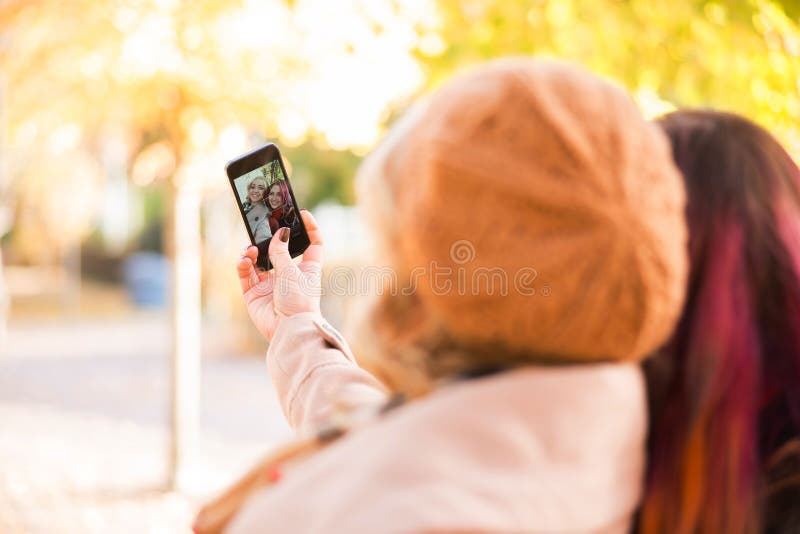 Two Girls Taking Selfies In The Autumn Park Stock Image Image Of Life