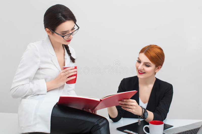 Two Girls Talking in the Office Stock Image - Image of businesswoman ...