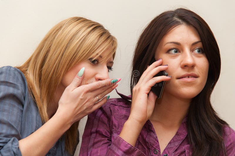 Two Girls Talking on the Phone Stock Image - Image of listen, black ...