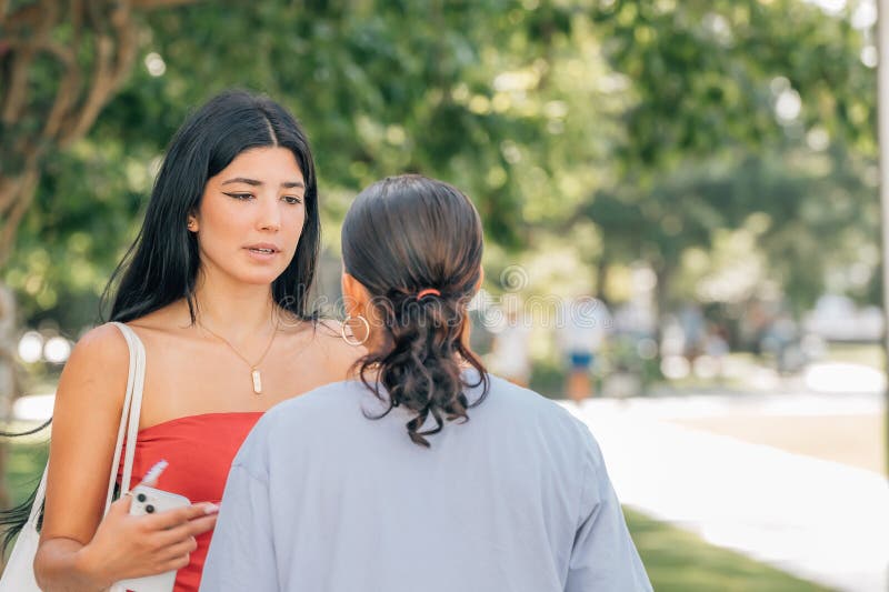 Two Girls Talking on the Street Stock Photo - Image of relationship ...