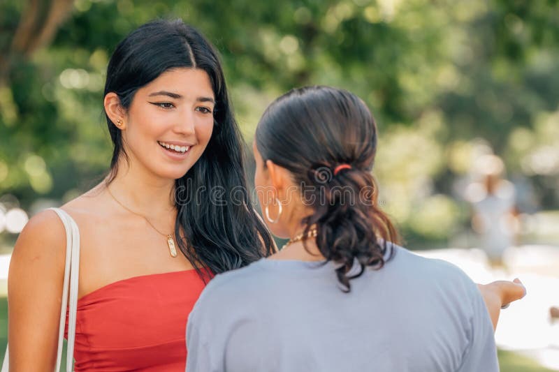 Two Girls Talking on the Street Stock Image - Image of summertime ...