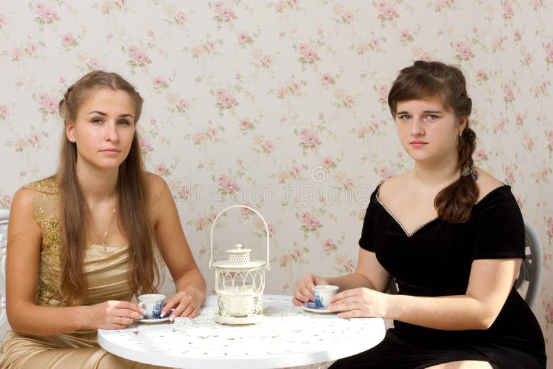 Two Girls Talking at a Table in a Cafe Stock Image - Image of beautiful ...
