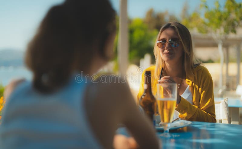 Two girls talking stock image. Image of adult, people - 315779887