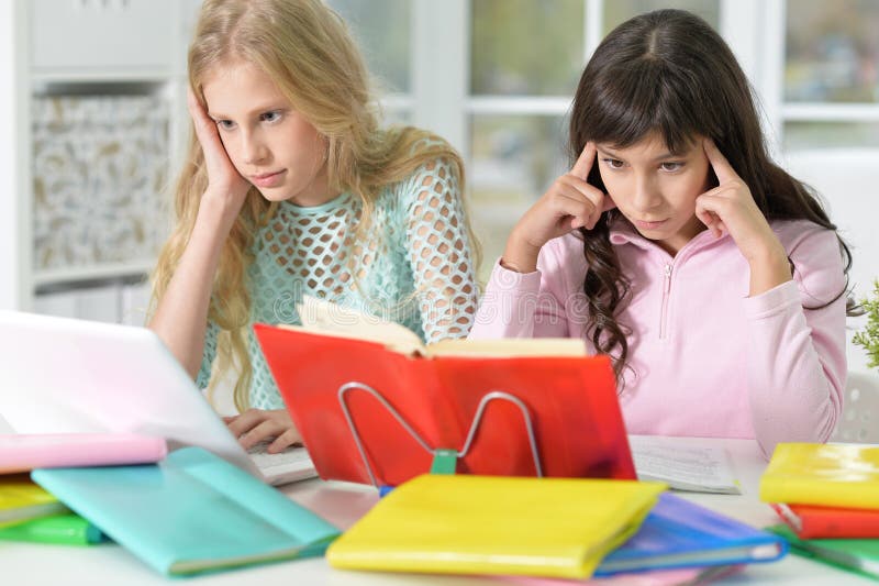 Two Girls with Their Homework Stock Image - Image of lesson, white ...
