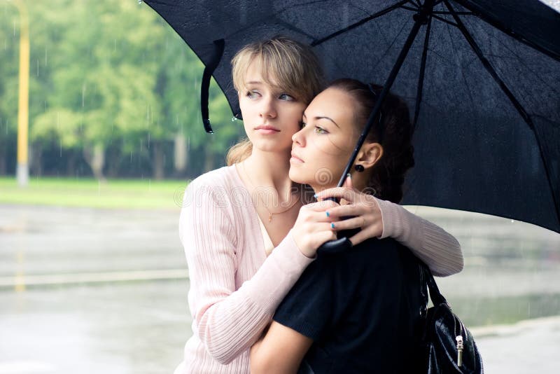 Two girls under umbrella stock image. Image of concept - 5478927