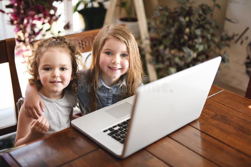 Two Girls Using Laptop on the Kitchen Table Stock Image - Image of ... Two Girls Using Laptop on the Kitchen Table Stock Image - Image of ...