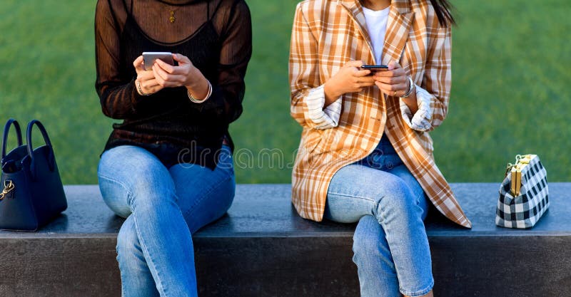 Two Girls Using Phone in the Park Stock Photo - Image of compulsive ...