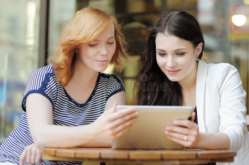 Two Girls Using Tablet Computer Stock Photo - Image of checking ...