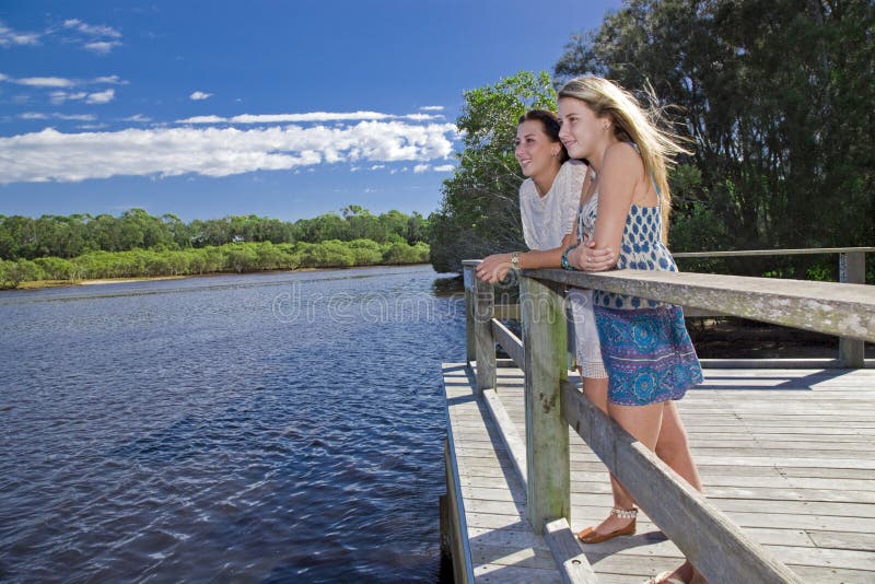 Two Girls on Viewing Platform by the Creek Stock Image - Image of ...
