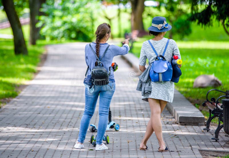 Two Girls Walk Through The City Stock Photo - Image of beautiful ...