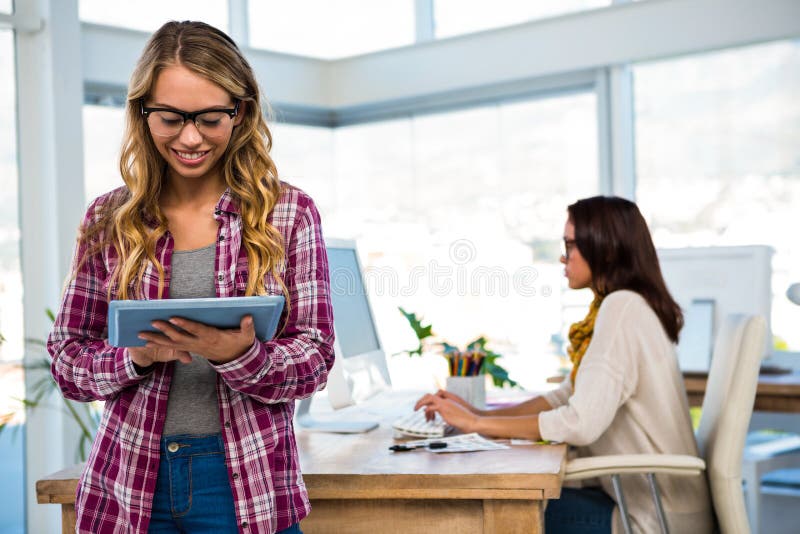 Two girls work at office stock photo. Image of attentively - 65392400