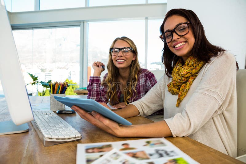 Two girls work at office stock image. Image of glasses - 65392555