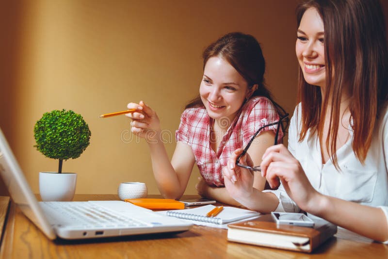 Two Girls Work at Office on Computer and Tablet Stock Image - Image of ...