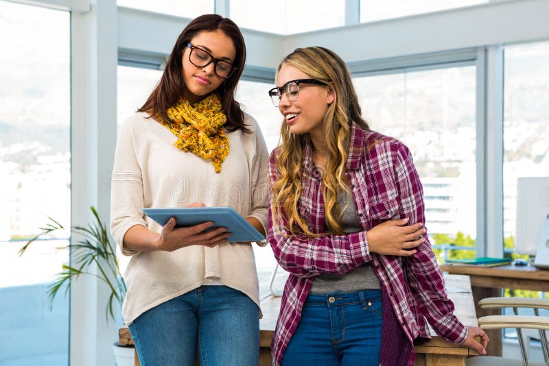 Two girls work at office stock photo. Image of attentively - 65392592