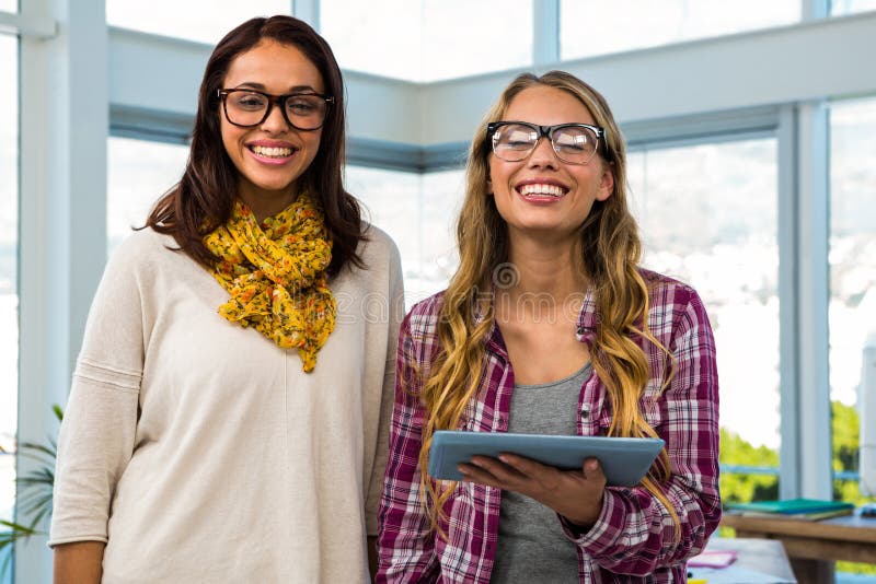 Two girls work at office stock photo. Image of concentrating - 65392638
