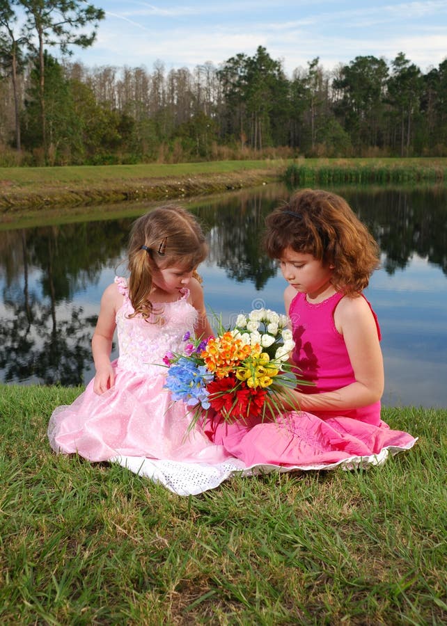 Two girlswith flowers stock image. Image of pretty, friends - 4705195