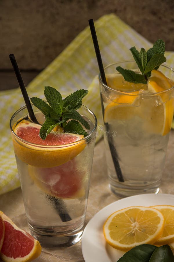 Two Glass Cups of Water with Red Orange, Lemon, Mint and Ice. Fr Stock ...