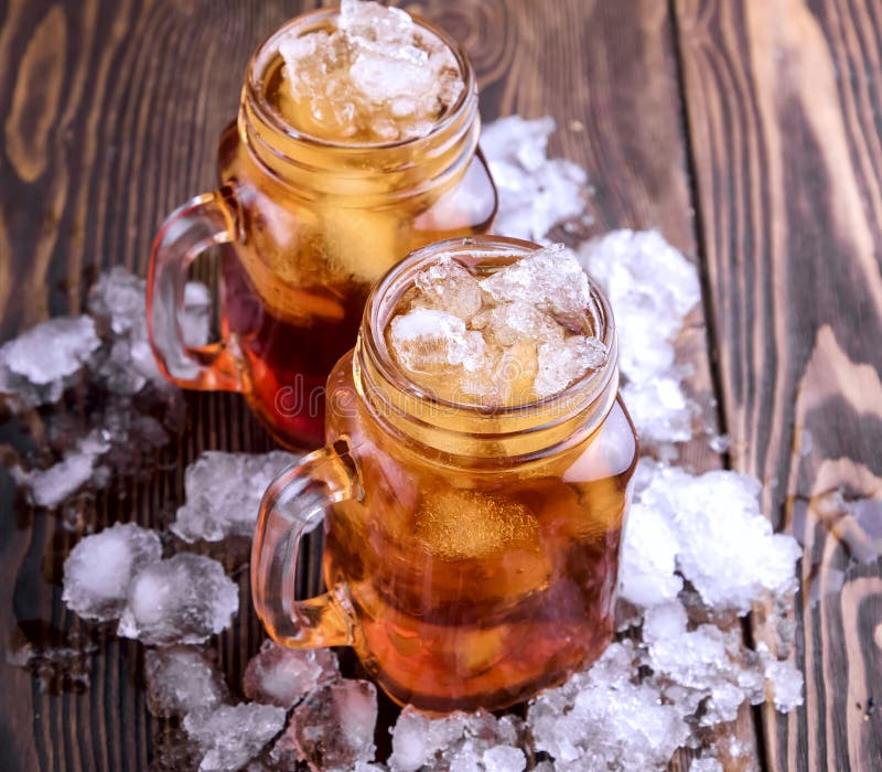 Two Glass Jars with Iced Tea on Rustic Background Stock Photo - Image ...
