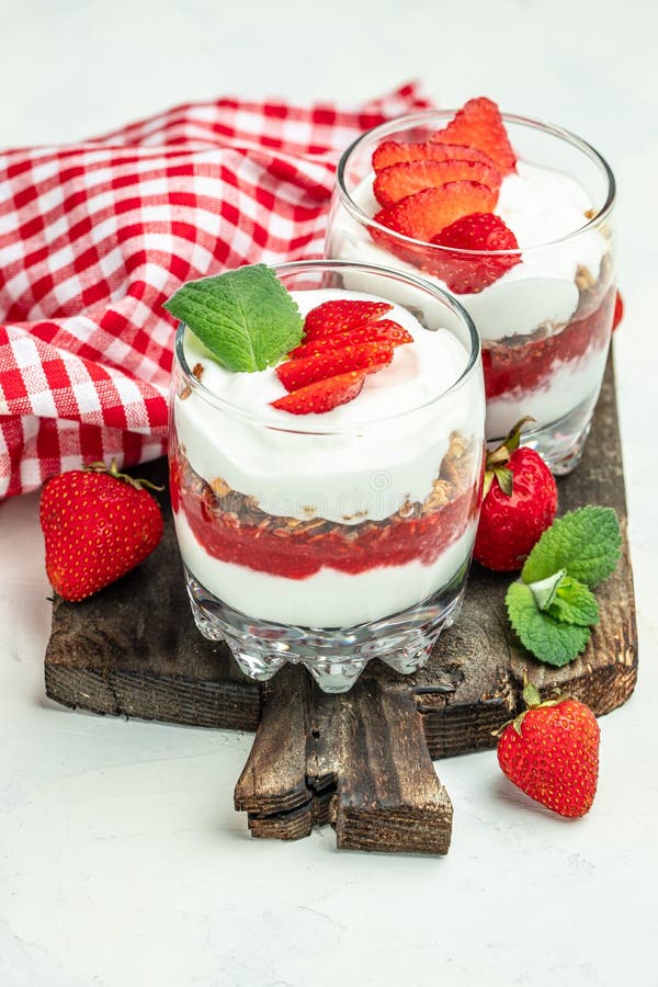 Two Glass of Parfait with Fresh Fruit, Yogurt and Granola on White ...