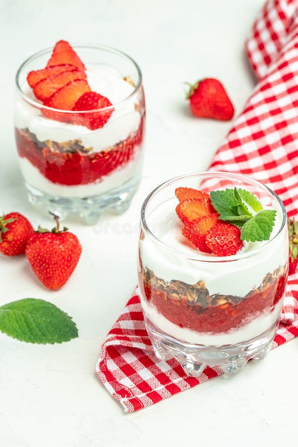 Two Glass of Parfait with Fresh Fruit, Yogurt and Granola on White ...
