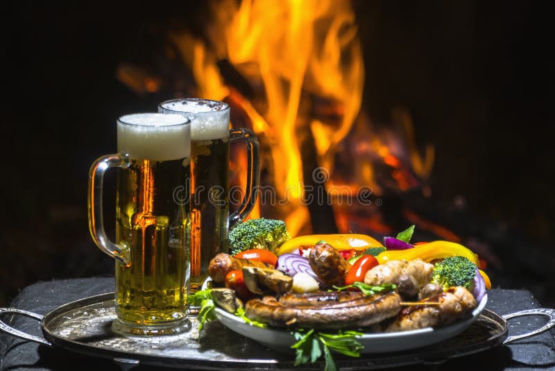 Two Glasses Of Beer On The Background Of Fire Stock Image - Image of ...