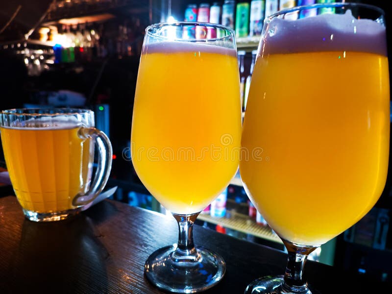 Two Glasses of Cold Foamy Beer on Bar Counter Stock Photo - Image of ...