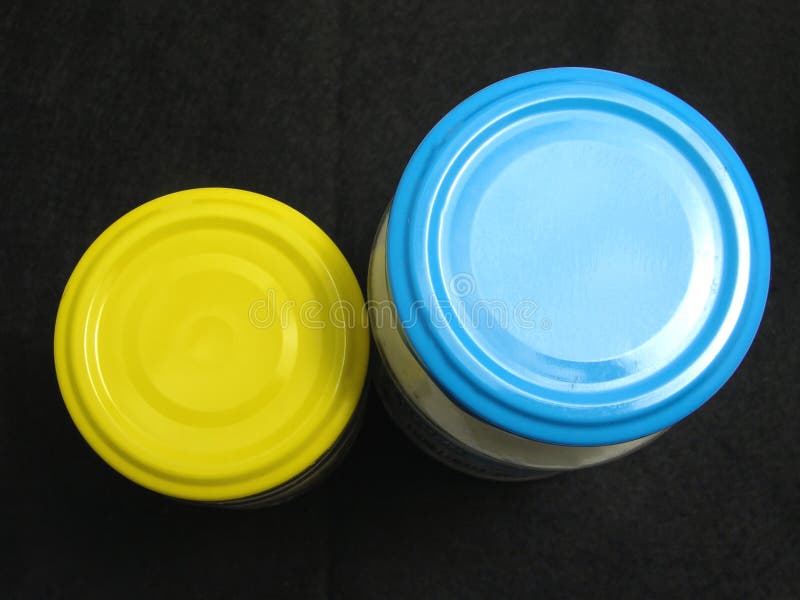 Two Glasses with Colored Lids Stock Image - Image of closure, black ...