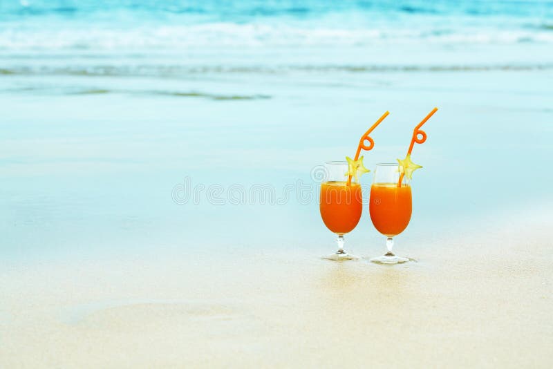 Two Glasses of Orange Juice Stock Photo - Image of juice, coastline ...