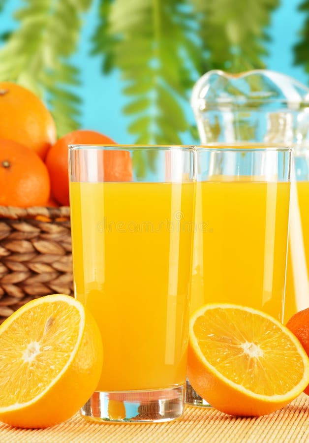 Two Glasses of Orange Juice and Fruits Stock Photo - Image of wicker ...